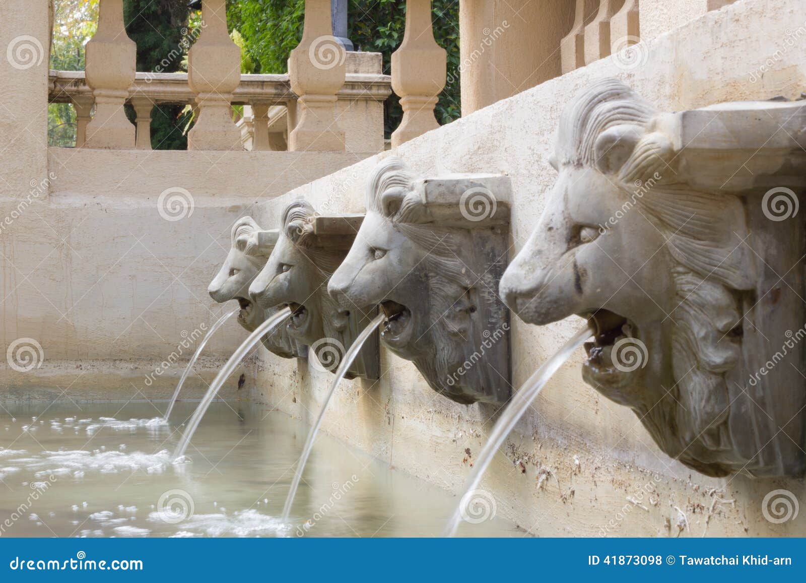 Water Flow from Statue Head of Lion in Public Park in Thailand Stock ...