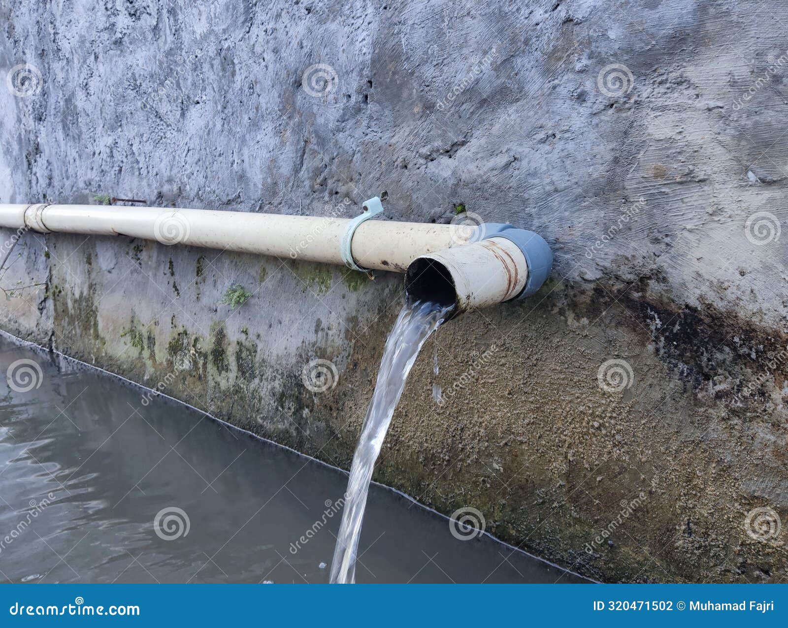 Photo of Water Flow from the Platform To the Fish Pond Stock Photo ...
