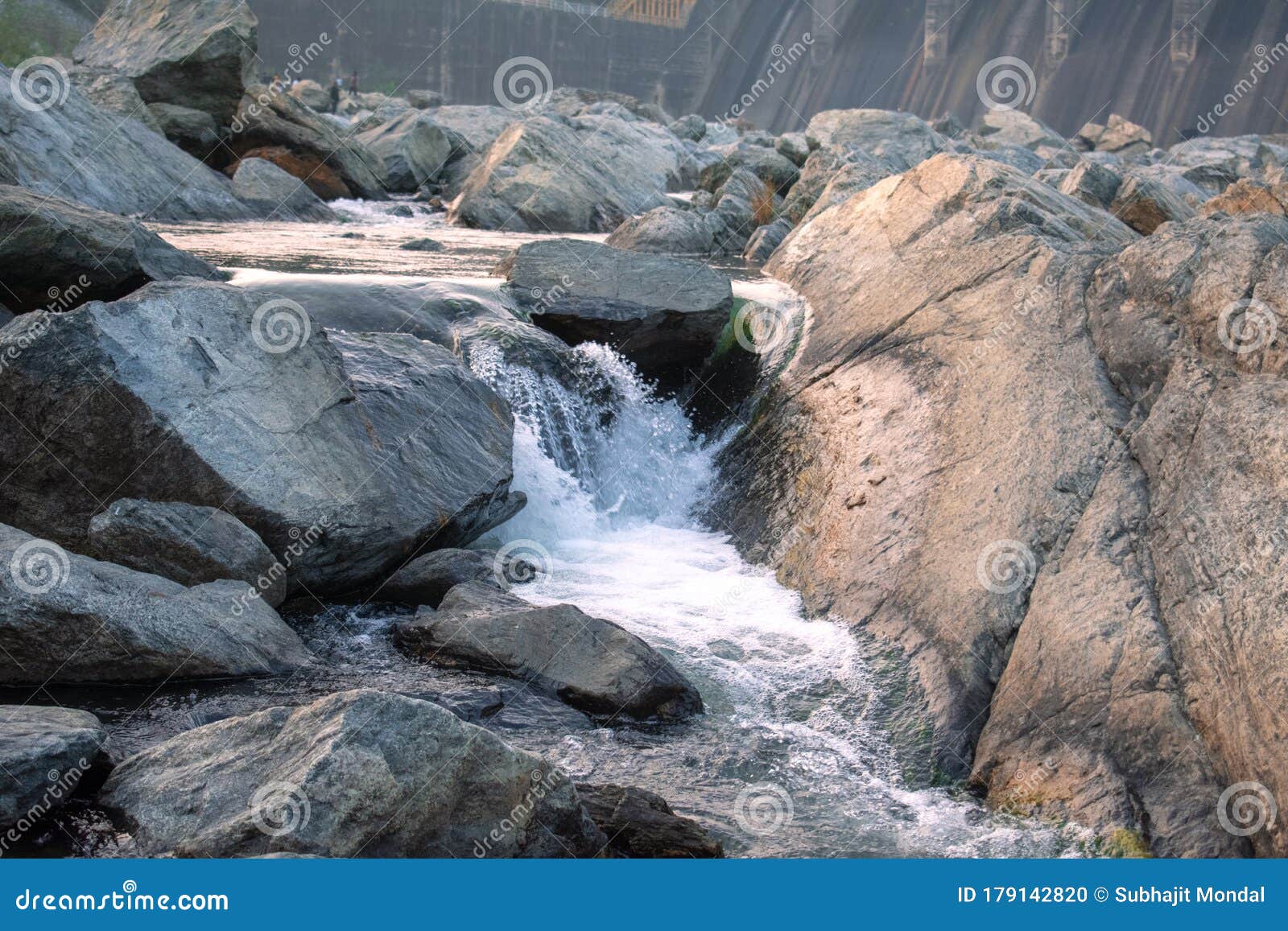 Water Flowing between the Big Rocks Forming a Small Waterfall Stock ...