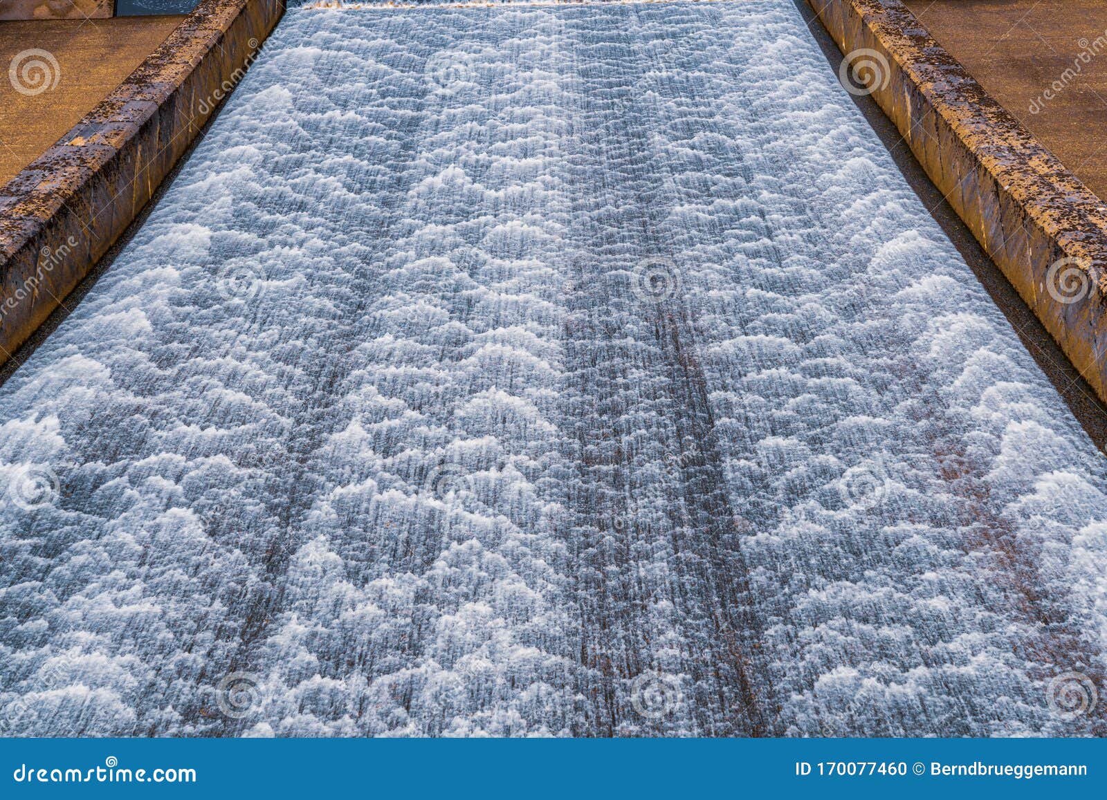 Water flowing down a dam stock photo. Image of texture - 170077460