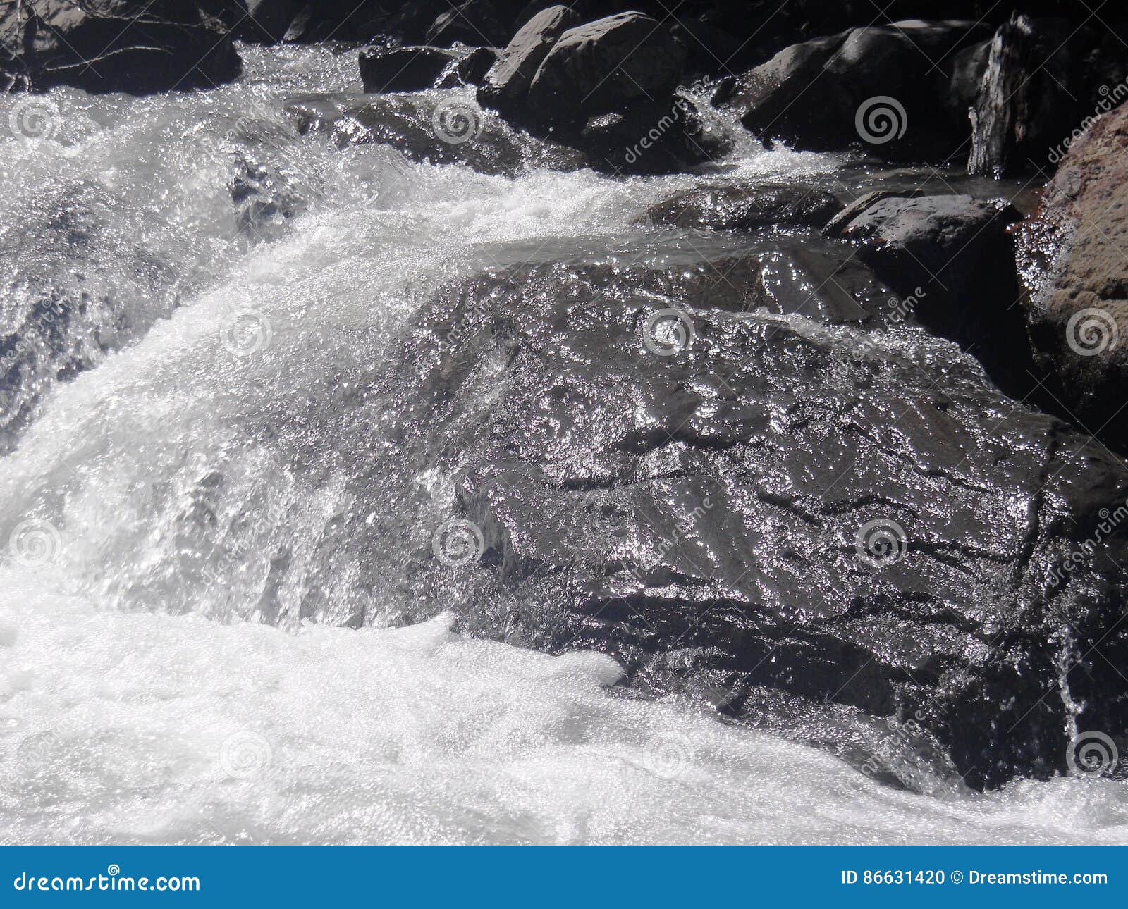 Water Flowing at High Speed Over and between the Stones. Stock Photo ...