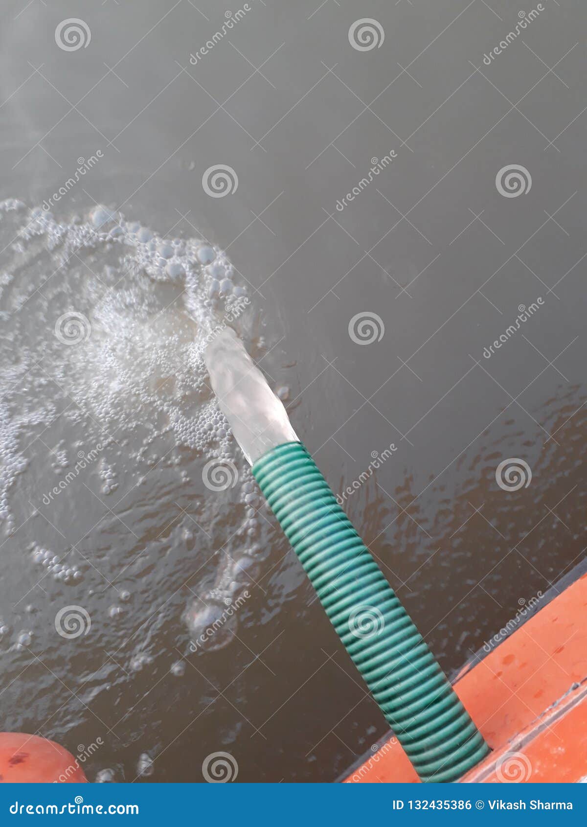 Water flowing from hose stock photo. Image of hose, nature - 132435386