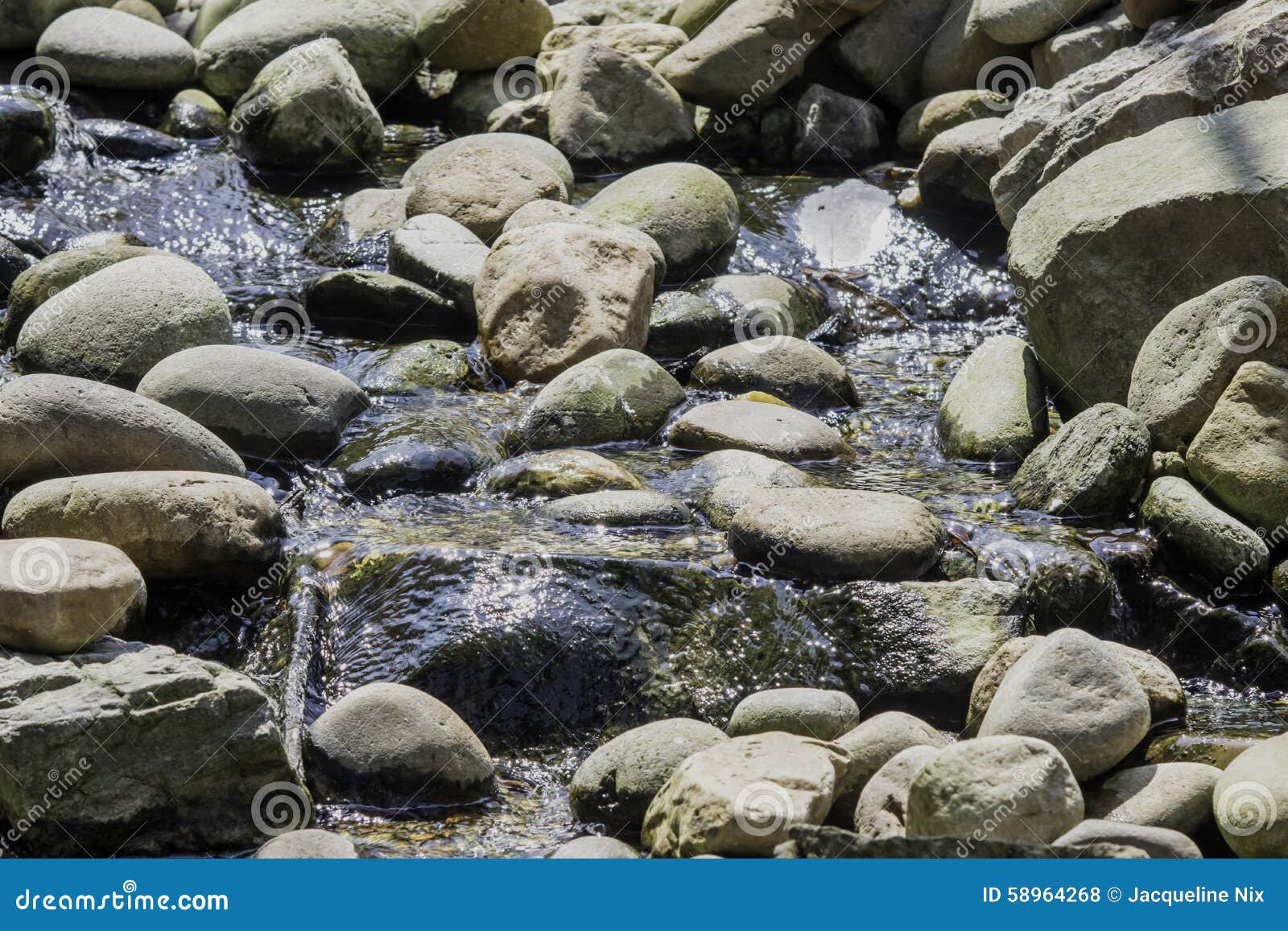 Water flowing over rocks stock photo. Image of creek - 58964268