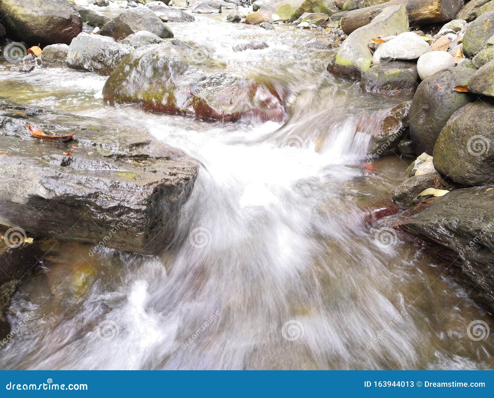 Water Flowing between Rocks Stock Image - Image of holiday, fast: 163944013