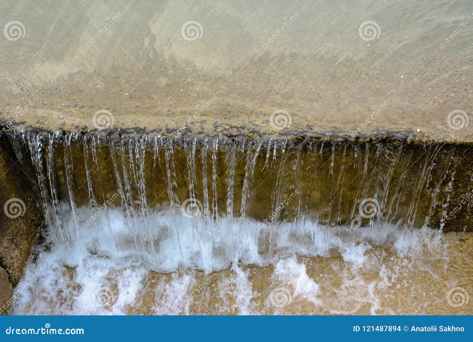 Water flows down on a step stock photo. Image of brown - 121487894