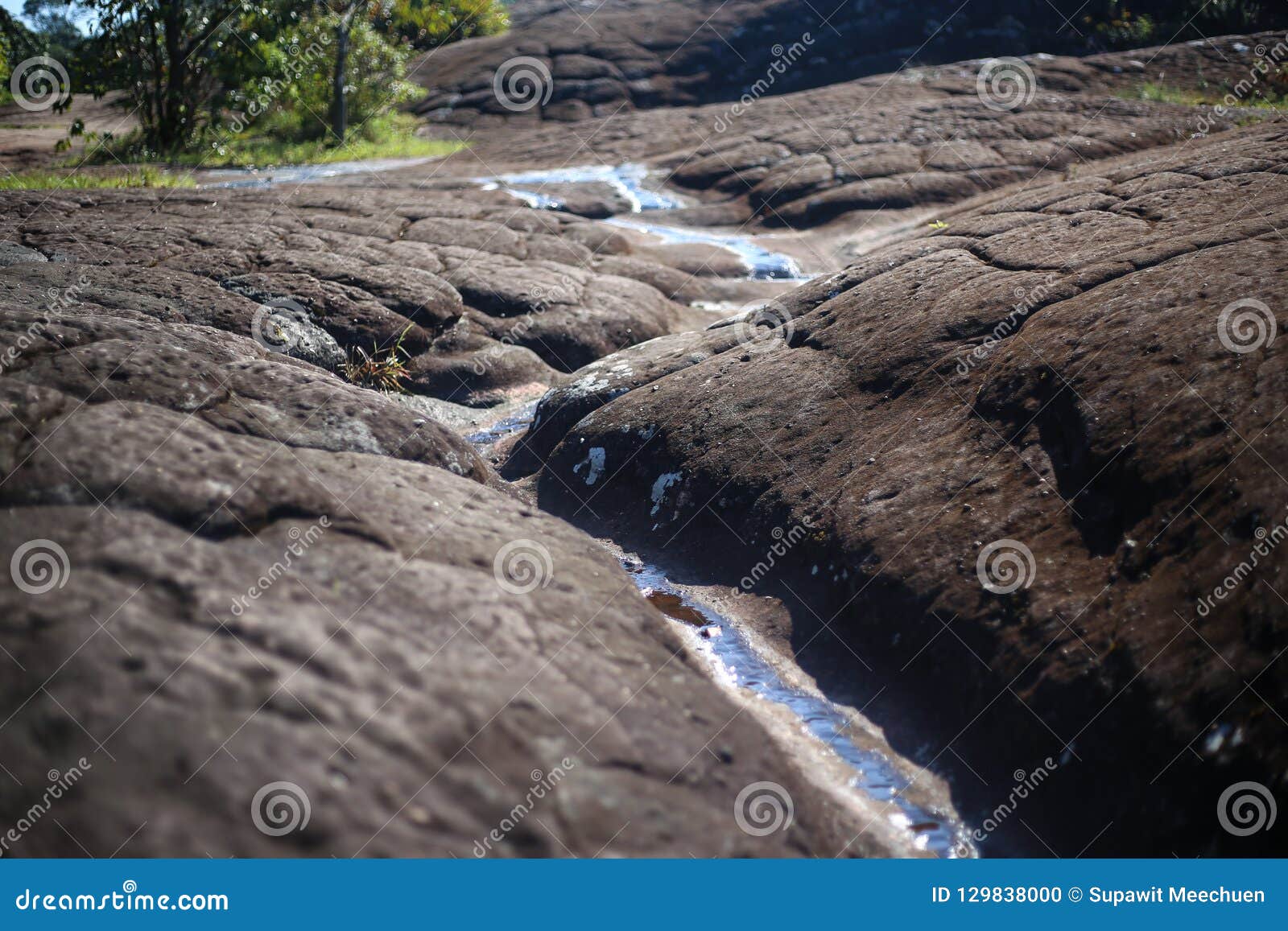Water Flows from the Mountain between the Rocks. Stock Photo - Image of ...