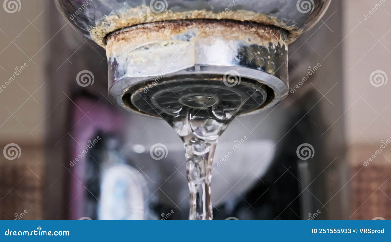 Water Flows From An Old Contaminated Tap With Calcium And Grime Into A