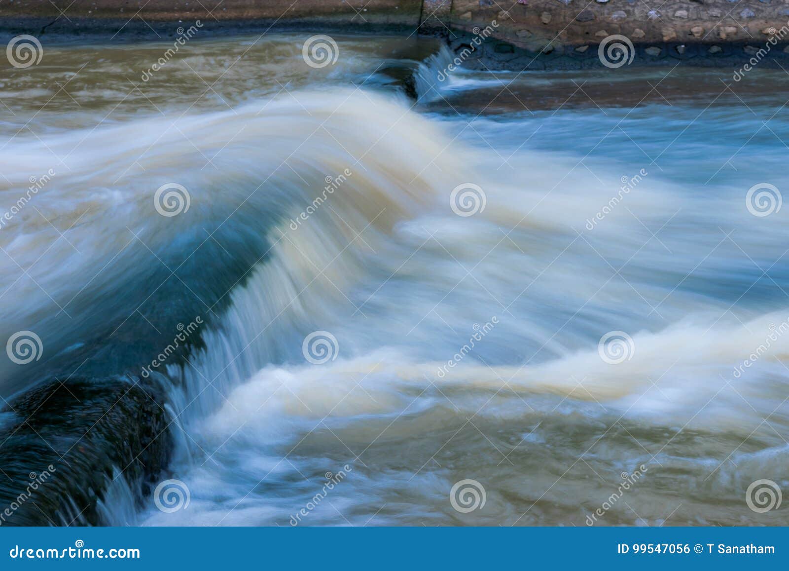Water flows over the dam. stock photo. Image of geology - 99547056