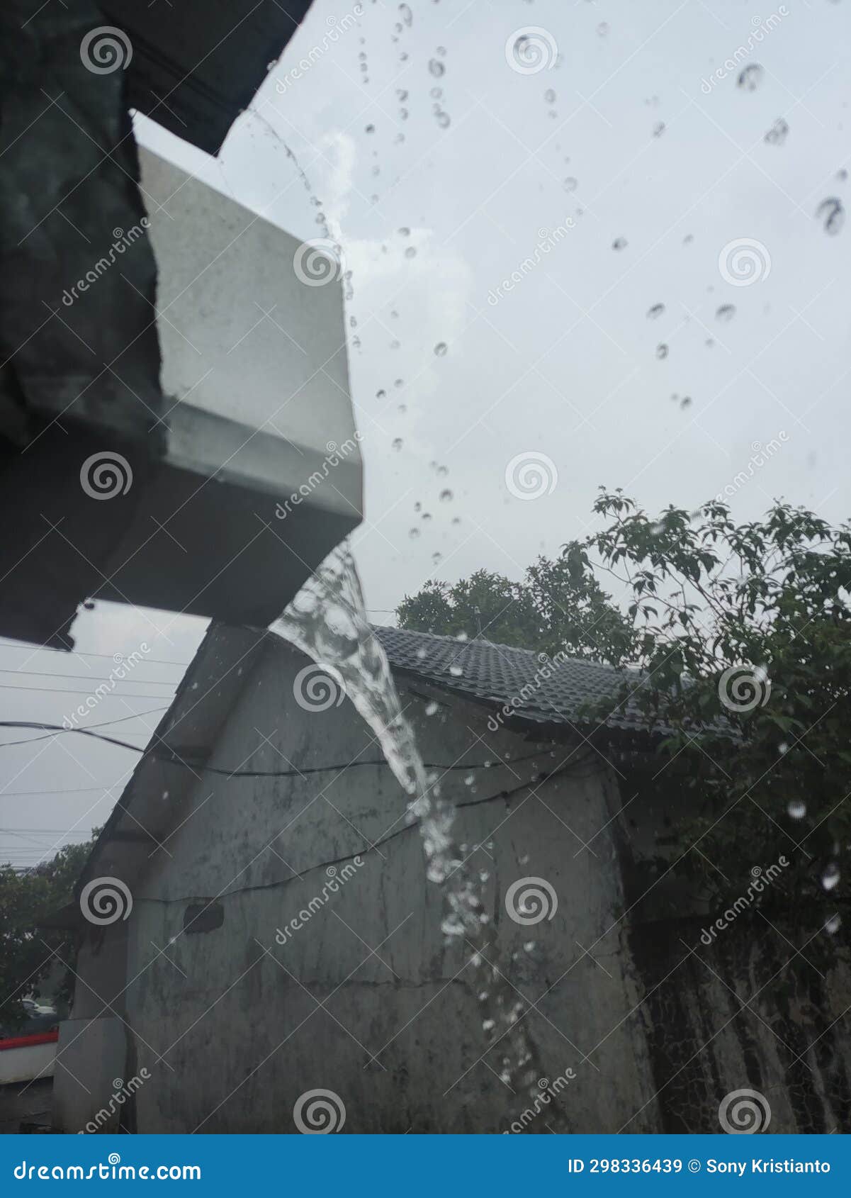 Water Flows Over the Gutter when it Rains Heavily in Front of the House ...
