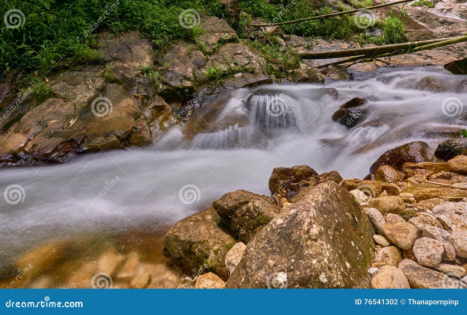 Water Flows Over Rocks in a Little Waterfall. Stock Photo - Image of ...