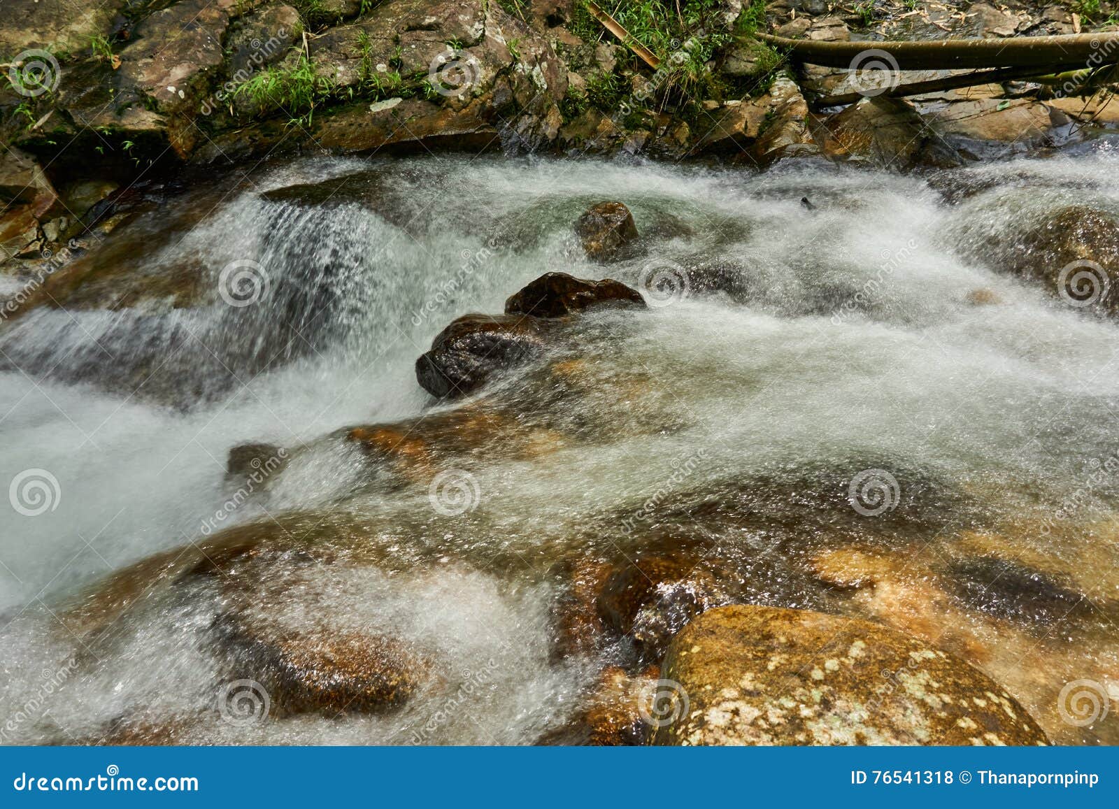 Water Flows Over Rocks in a Little Waterfall. Stock Photo - Image of ...