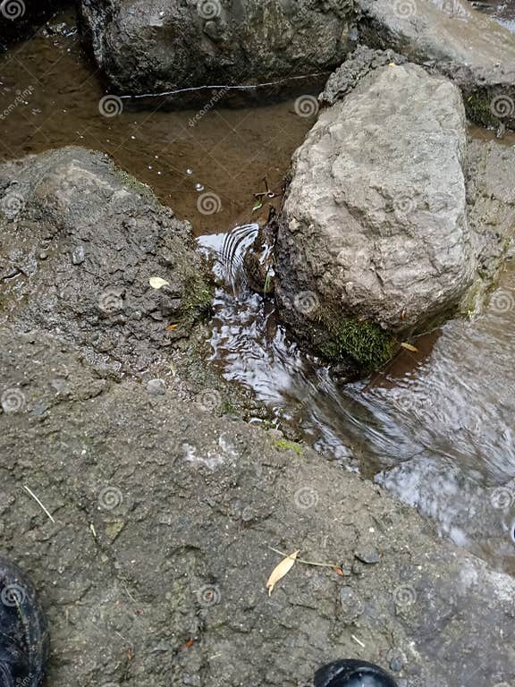 Water Flows through a Passage Stock Photo - Image of terrain, stream ...