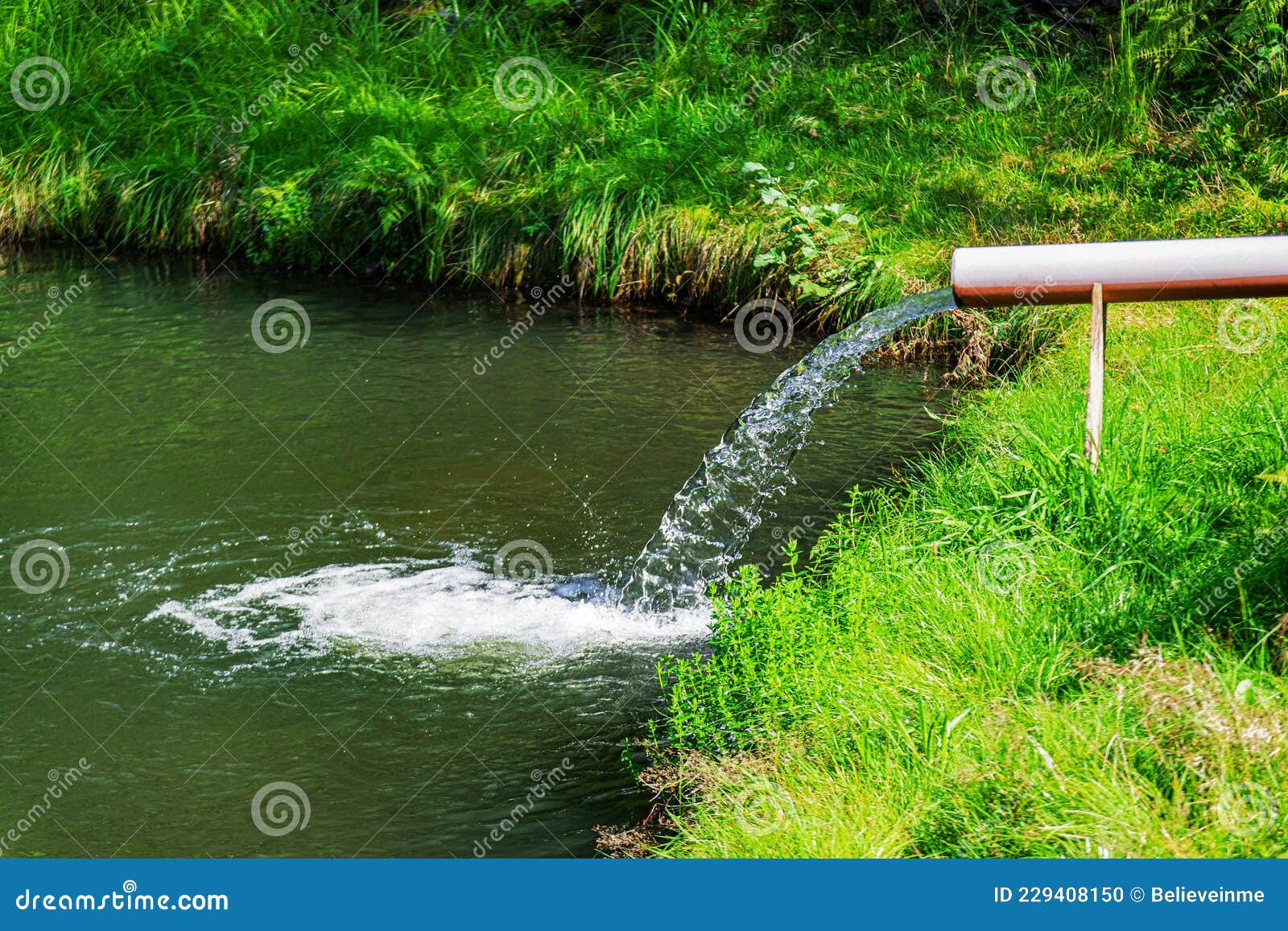 Water Flows through a Pipe into Lake. Stock Photo - Image of creek ...