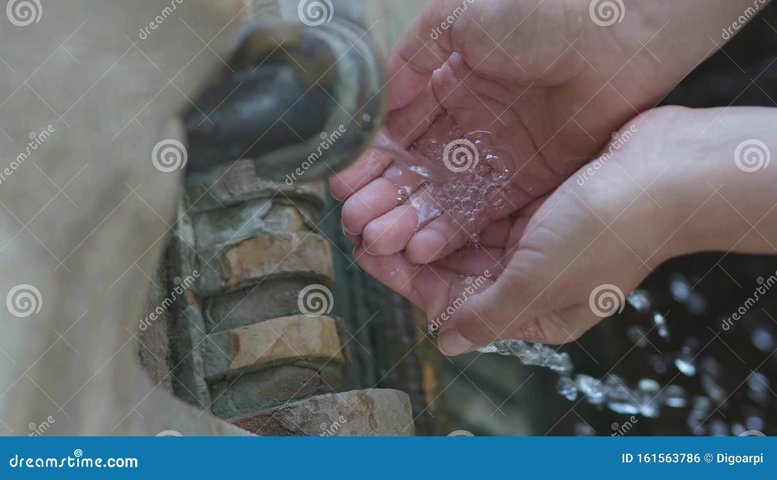 Water Flows from the Street Tap To Two Hands Stock Footage - Video of ...