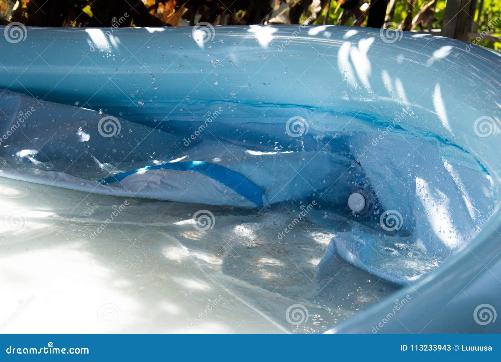 Water Flows through the Valve in the Inflatable Pool. Blue Background ...