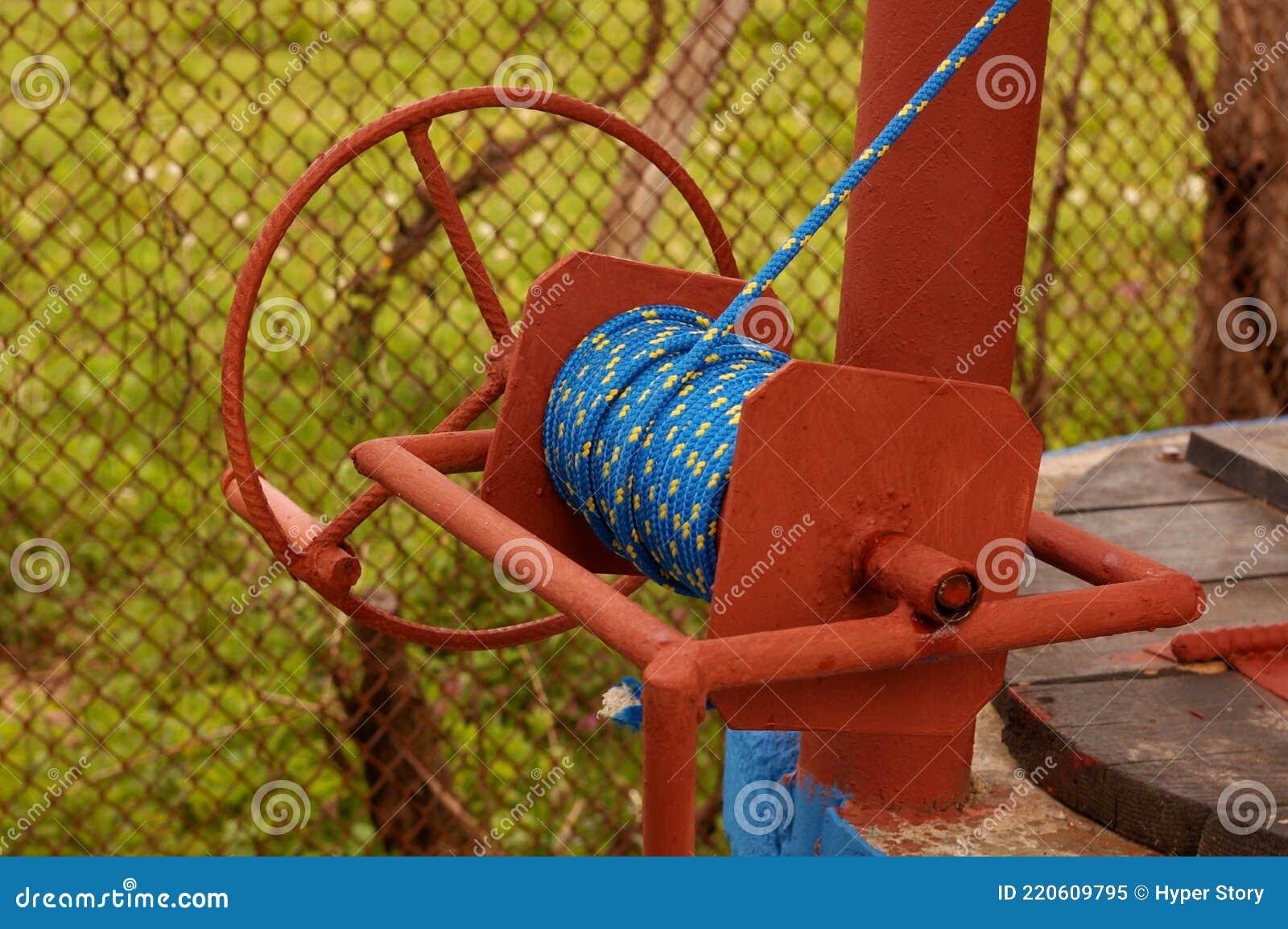 Water Fountain Crank with Blue Rope. Metal Crank on a Rustic Fountain ...