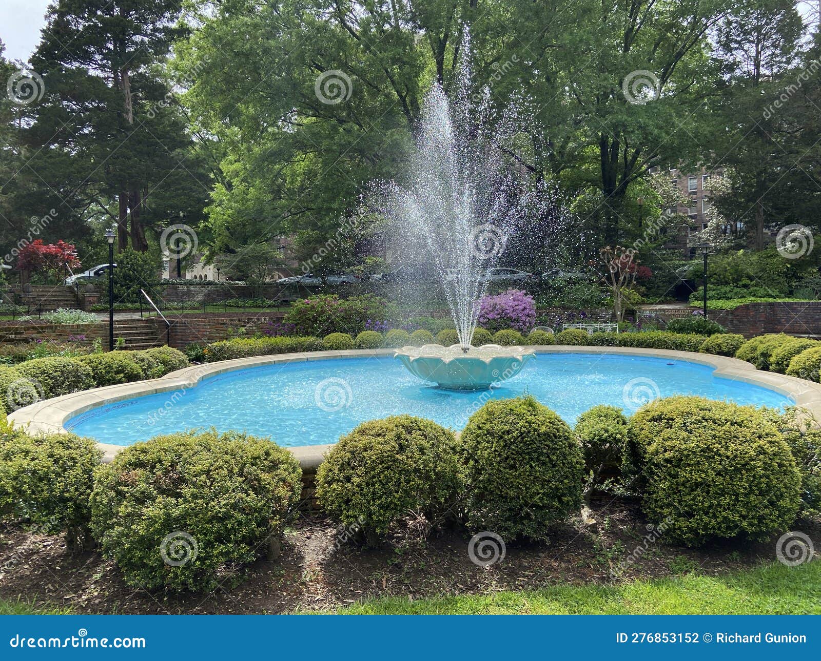 Water Fountain in Spring in May Stock Photo - Image of fountain, shrub ...