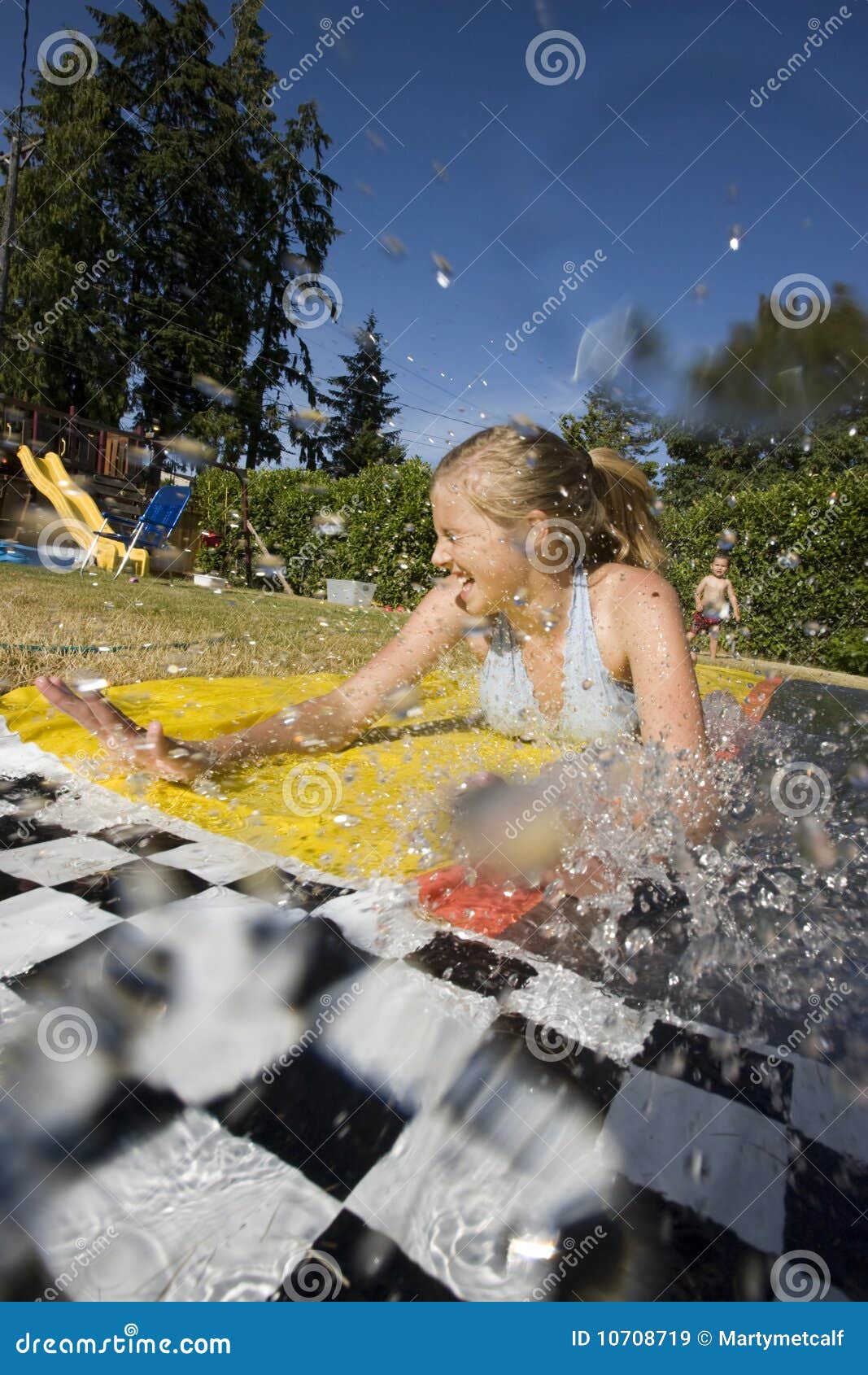 Water fun with young girl stock image. Image of playful - 10708719