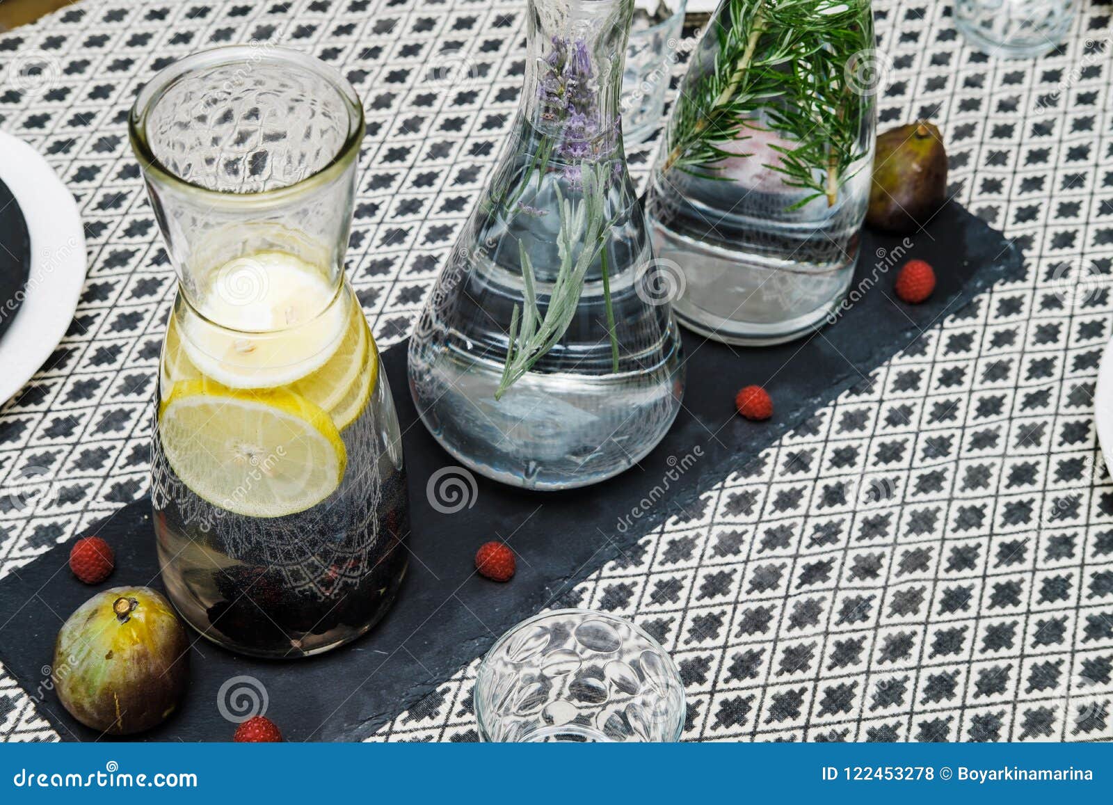 Water in Glass Decanters with Oregano and Served Table Stock Photo ...
