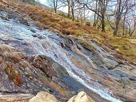 Water going down waterfall stock photo. Image of waterfall - 214235740