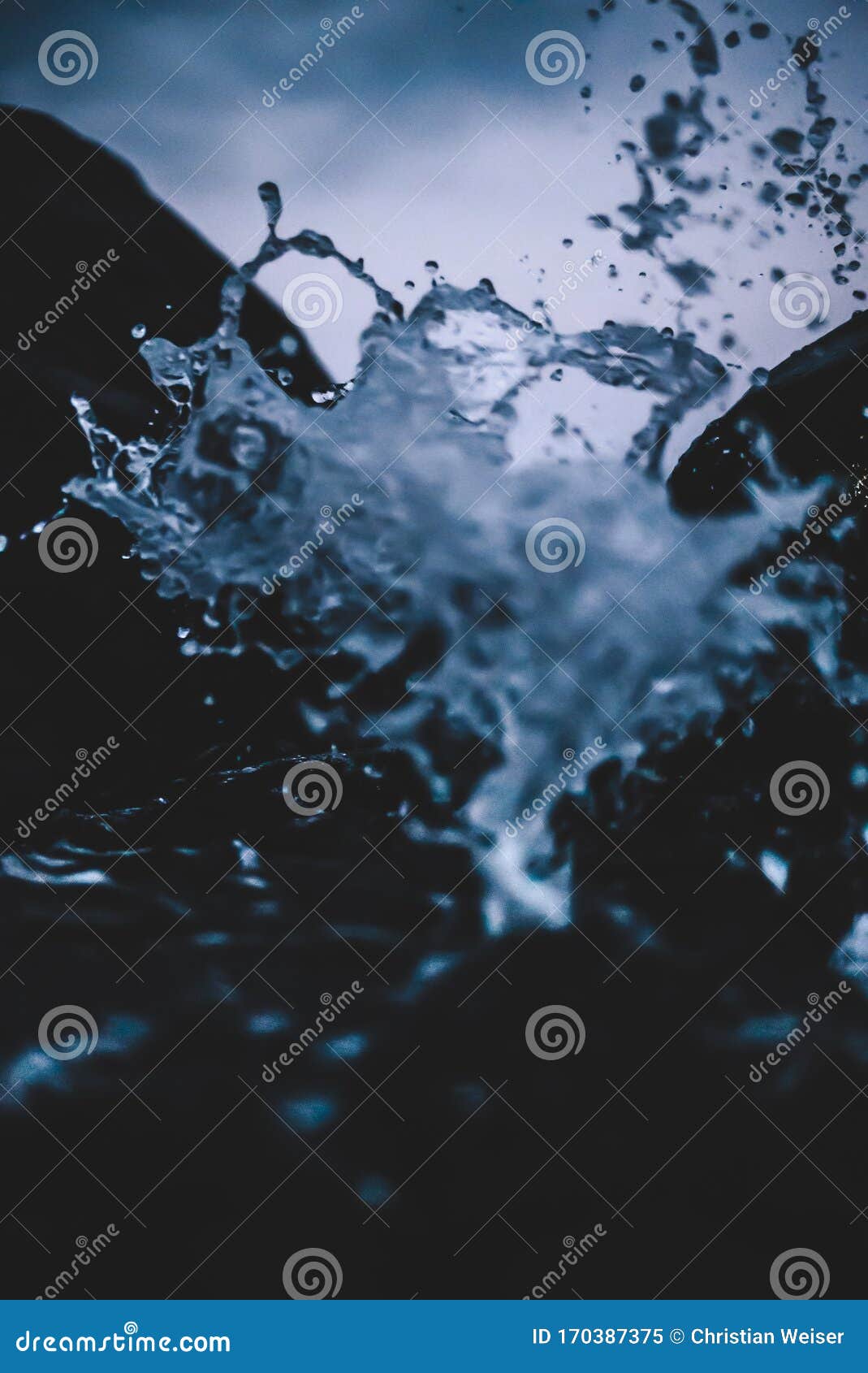 Water Hitting Rocks and Small Drops Splash into the Camera Stock Image ...