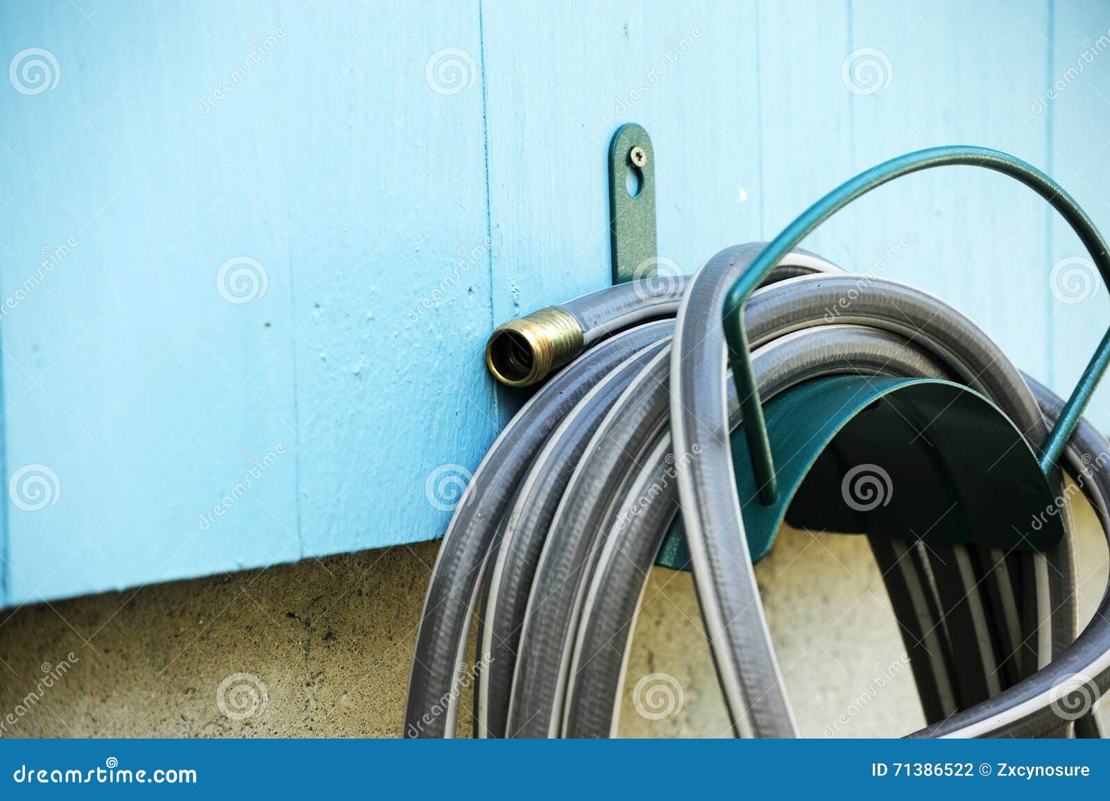 Water Hose Circled by the House Side Stock Photo - Image of spiral ...