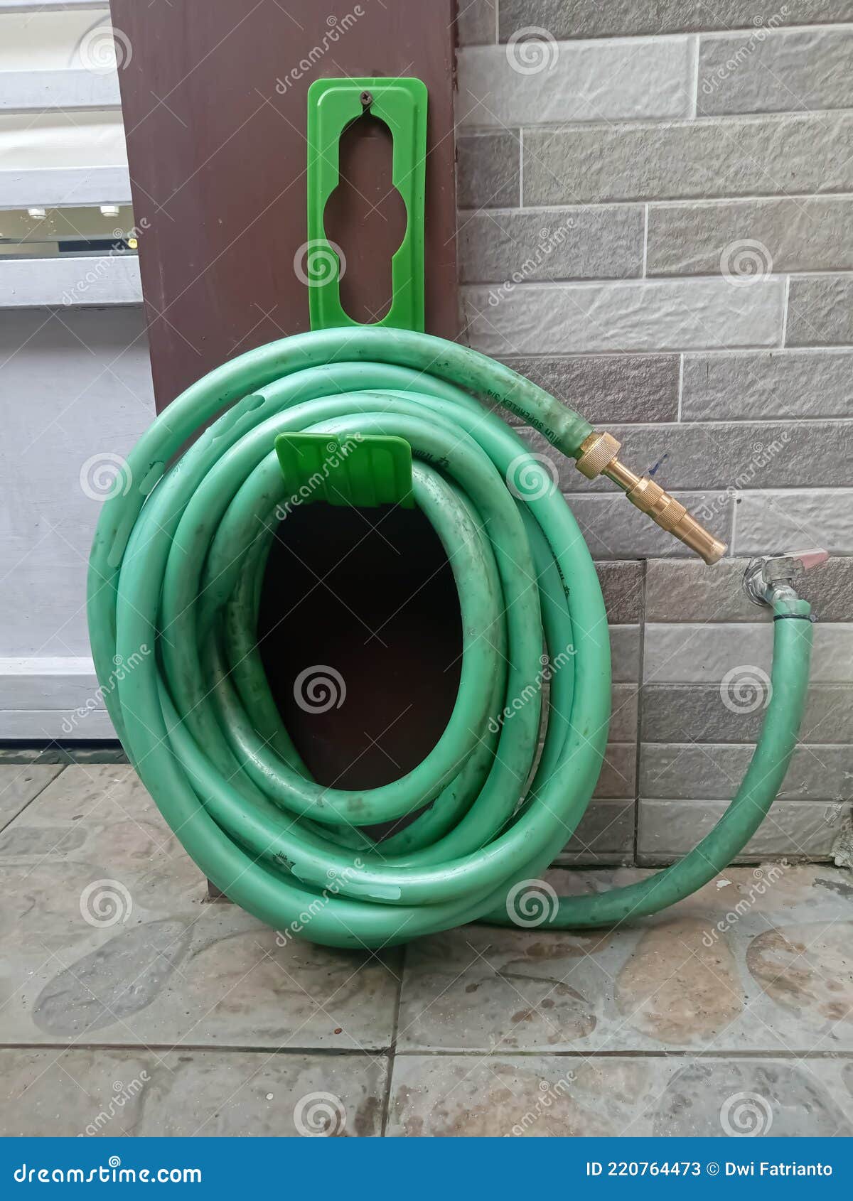 The Water Hose is Rolled Up because it& X27;s Not in Use Stock Image ...