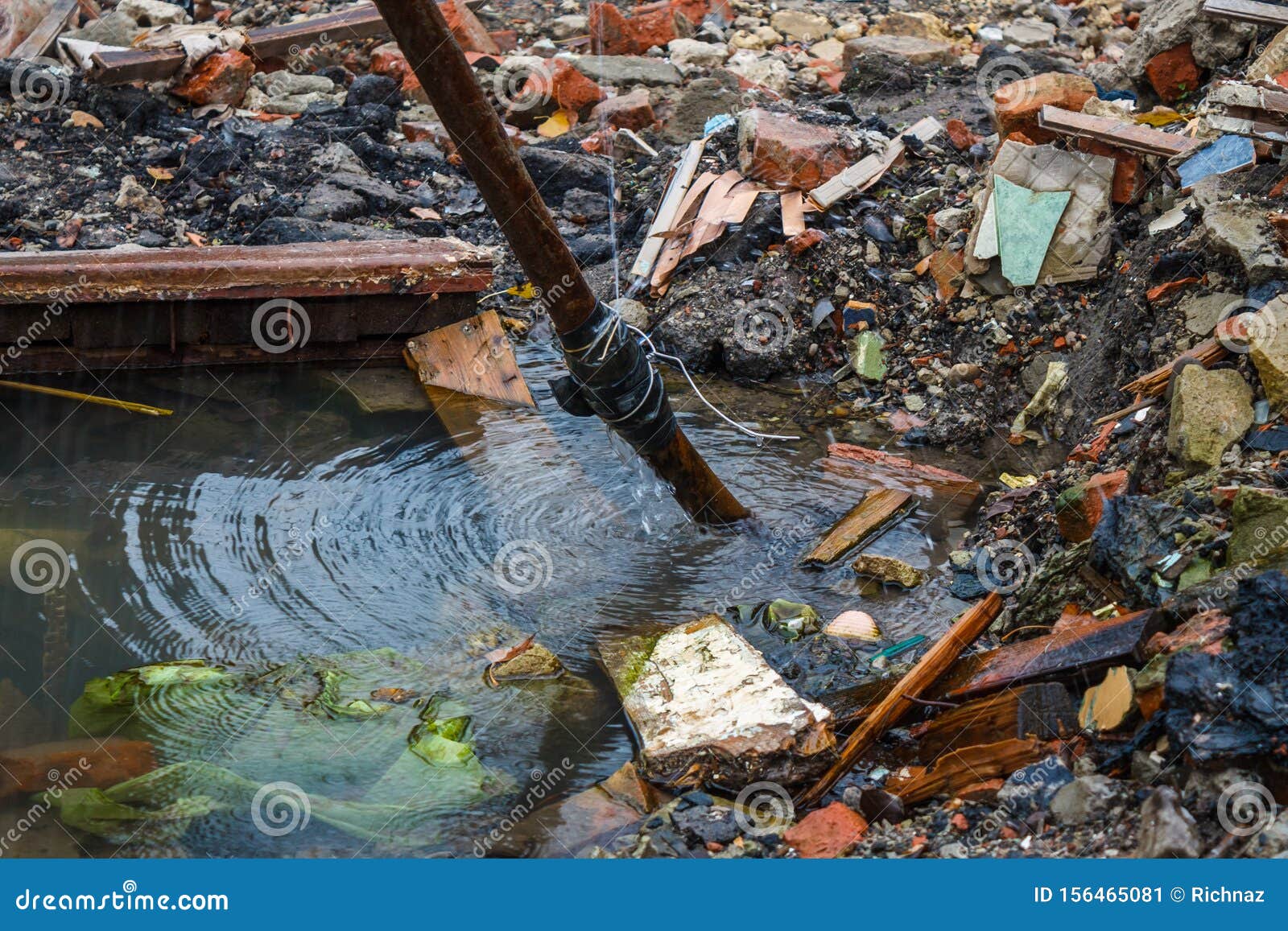 Water Jet from the Burst Pipe. a Pool about a Water Supply System Stock ...
