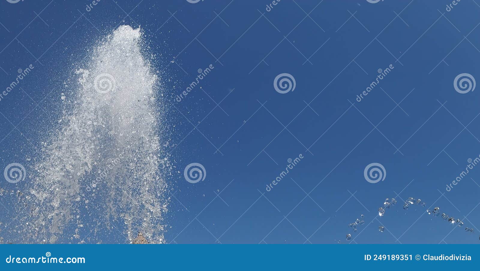 Water jet over blue stock image. Image of landmark, drop - 249189351