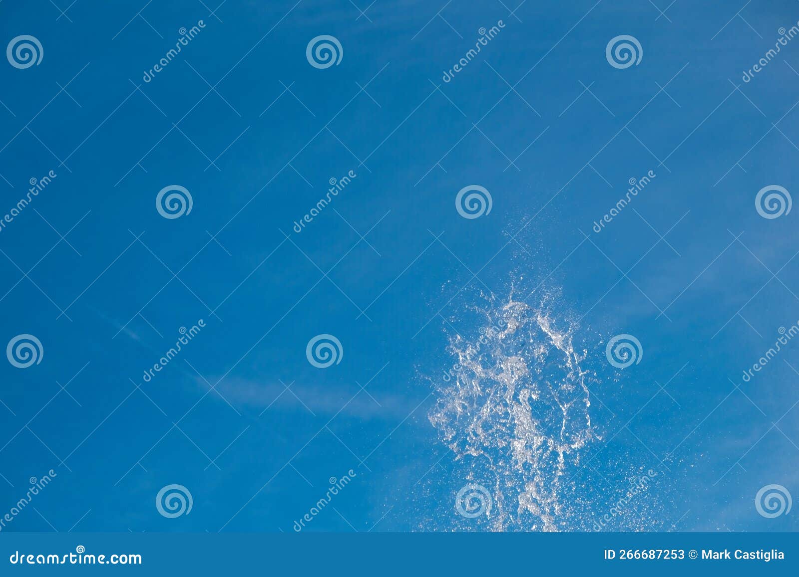 Water Jet Splashing and Sparkling in Bright Sunny Blue Sky Stock Image ...