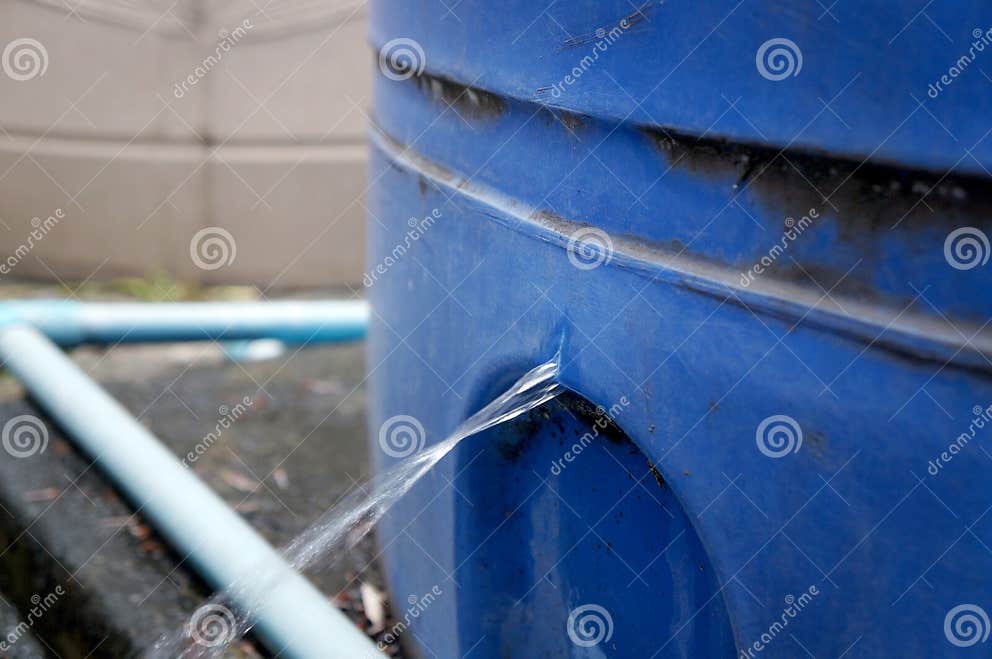 Water Leaking from Blue Tank. Water Tank Rupture Stock Photo - Image of ...