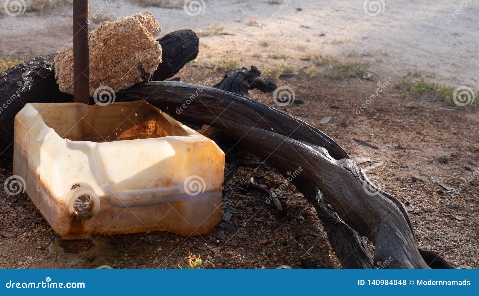Water Conservation, Saving Dripping Water in a Container, Garden Stock ...