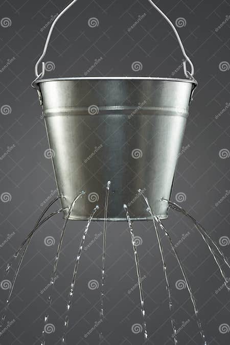 Water leaking from bucket stock image. Image of bucket - 30848081