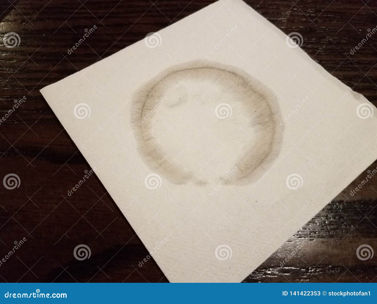 Water Mark or Ring from Cup or Glass on White Napkin on Brown Table ...