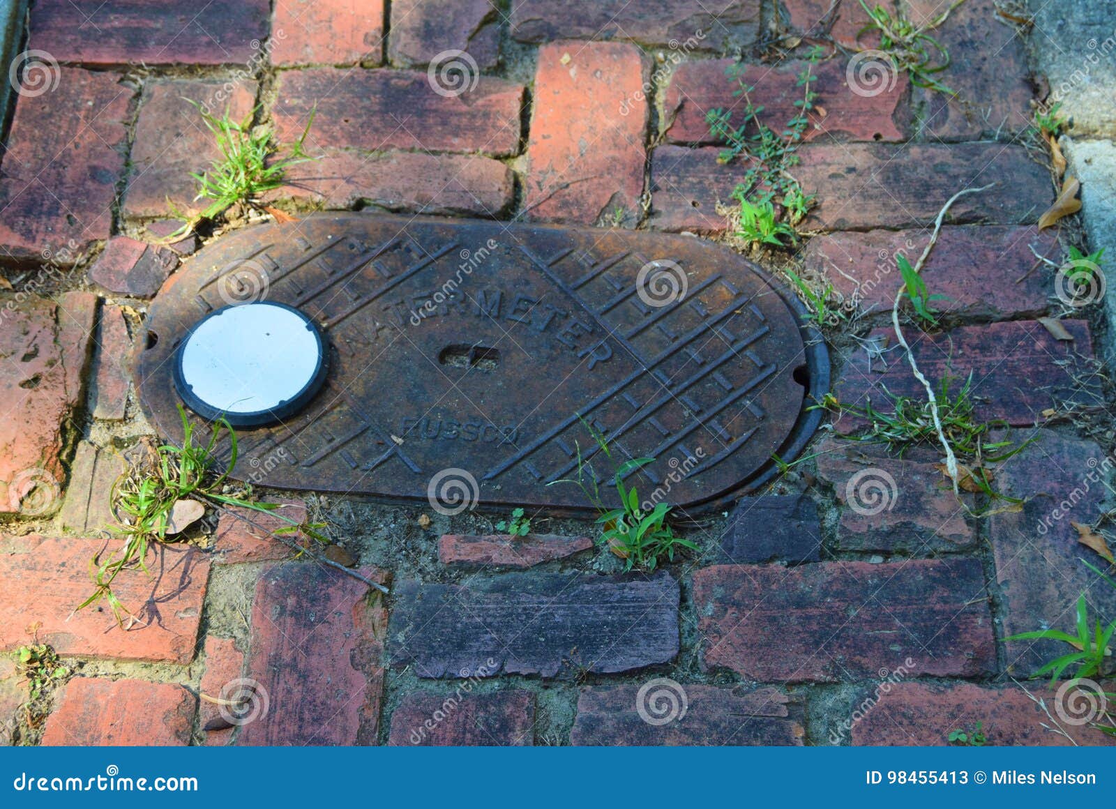 Water meter cover 1 stock image. Image of iron, brick - 98455413