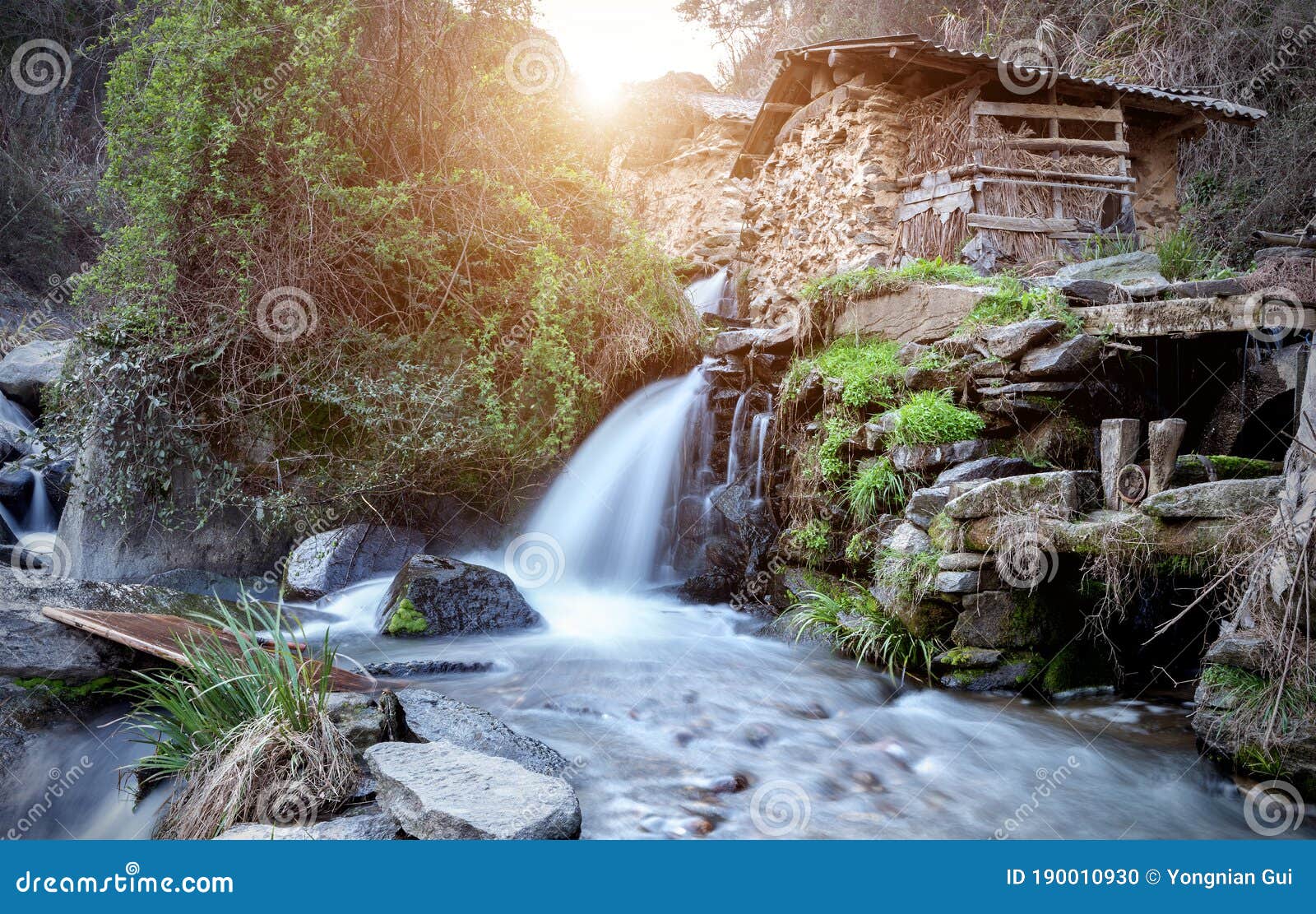 A Water Mill in a Remote Mountain Area, a Mechanical Device that Uses a ...
