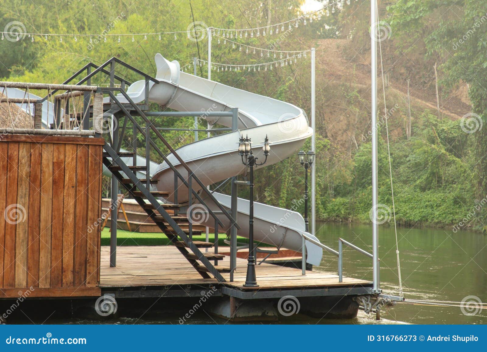 The Water Park Slide Goes into the River Stock Image - Image of holiday ...