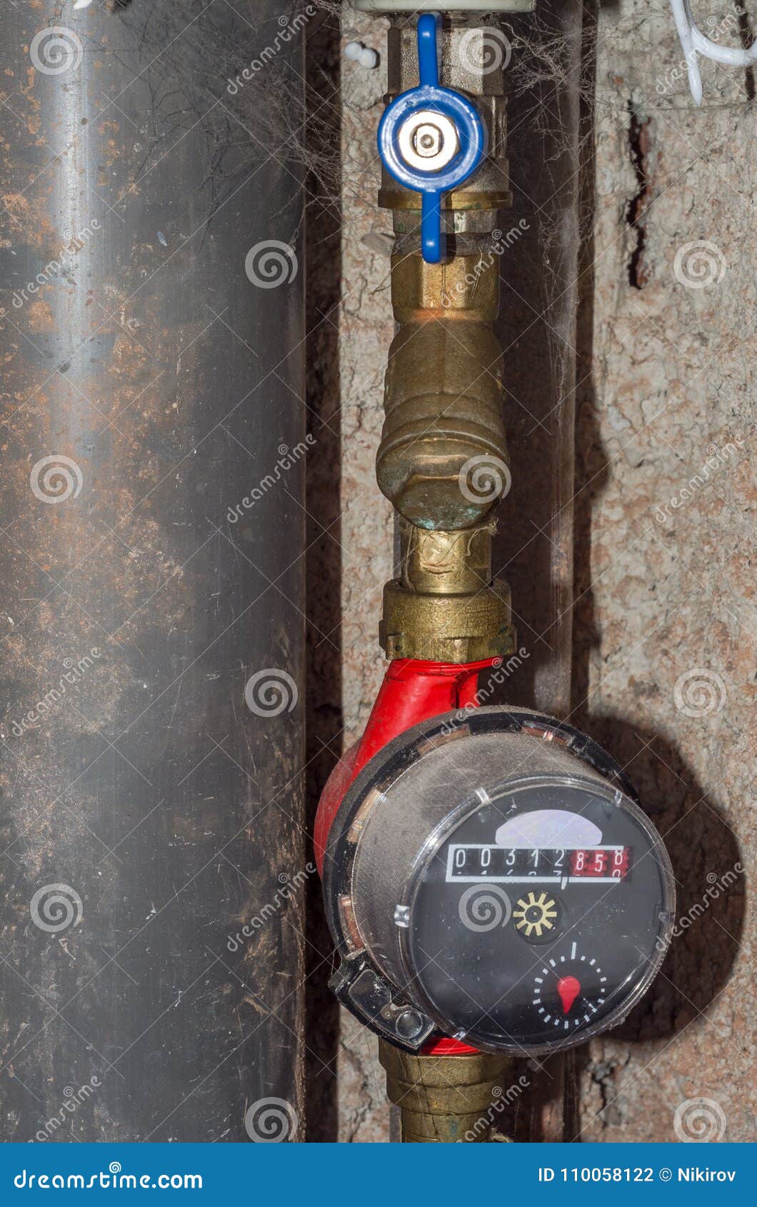 Water Pipe with a Tap and Cold Water Meter in an Old Room with a Cobweb ...