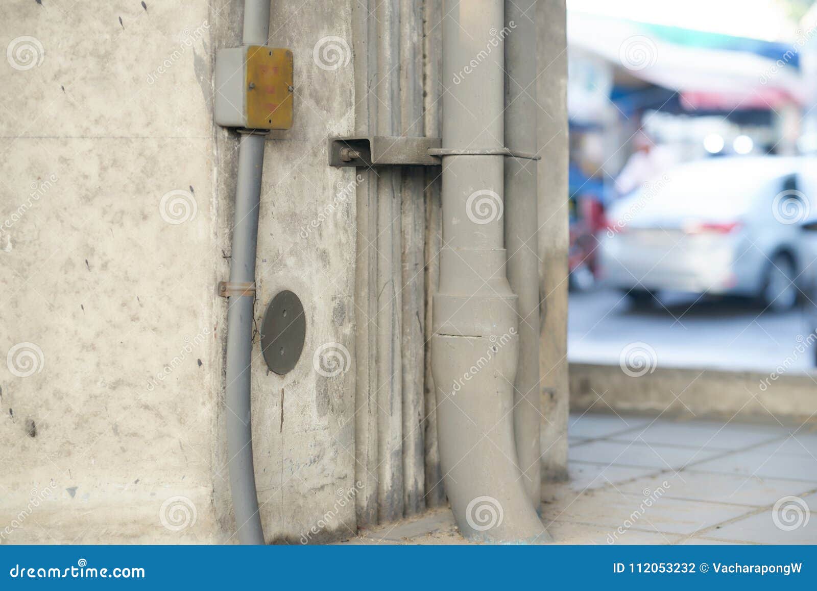Water Pipe on Wall and Electic Line on Street with Blur View Stock ...