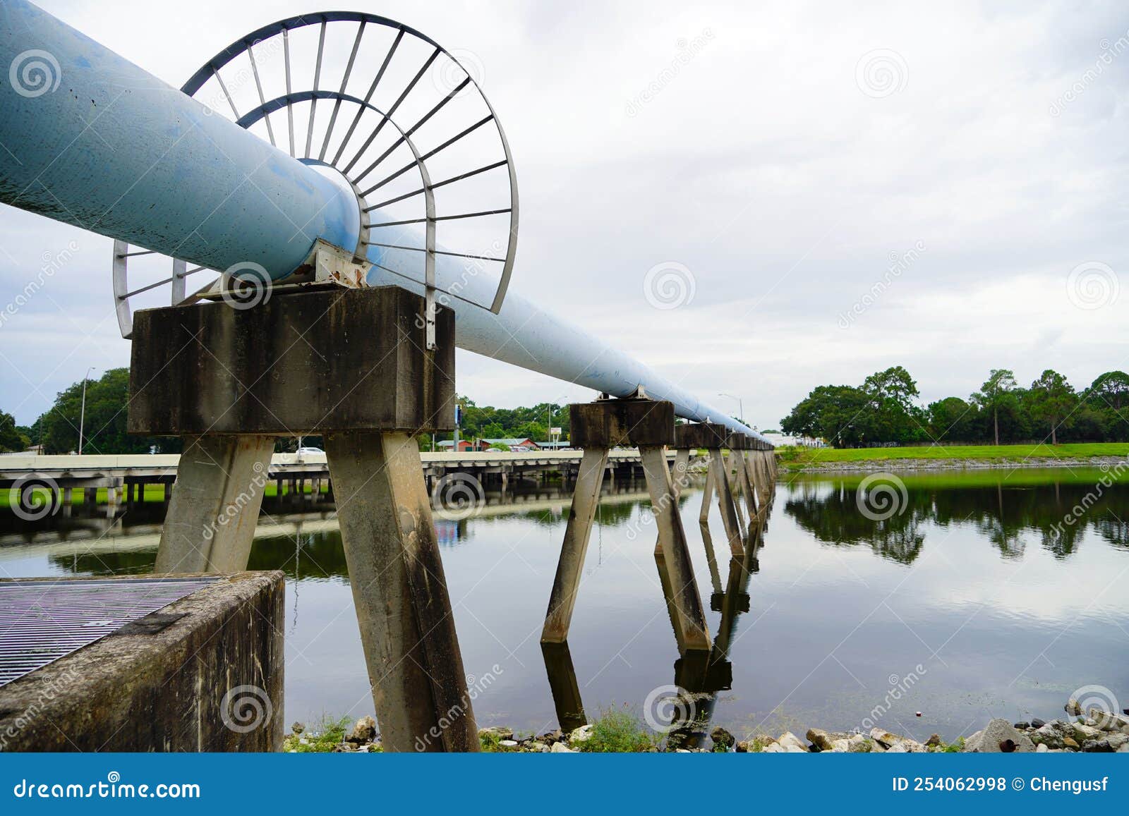 Water Pipe Above a Canal or River Stock Photo - Image of fall, grass ...