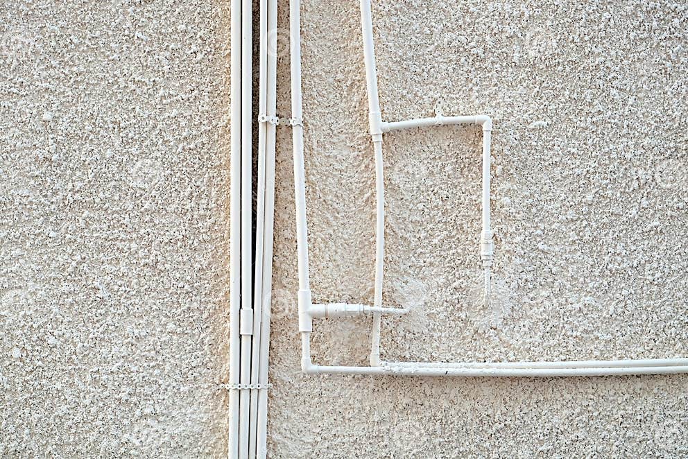 Water Pipes are Fixed on the Outer Side of the Stone Wall of the House ...