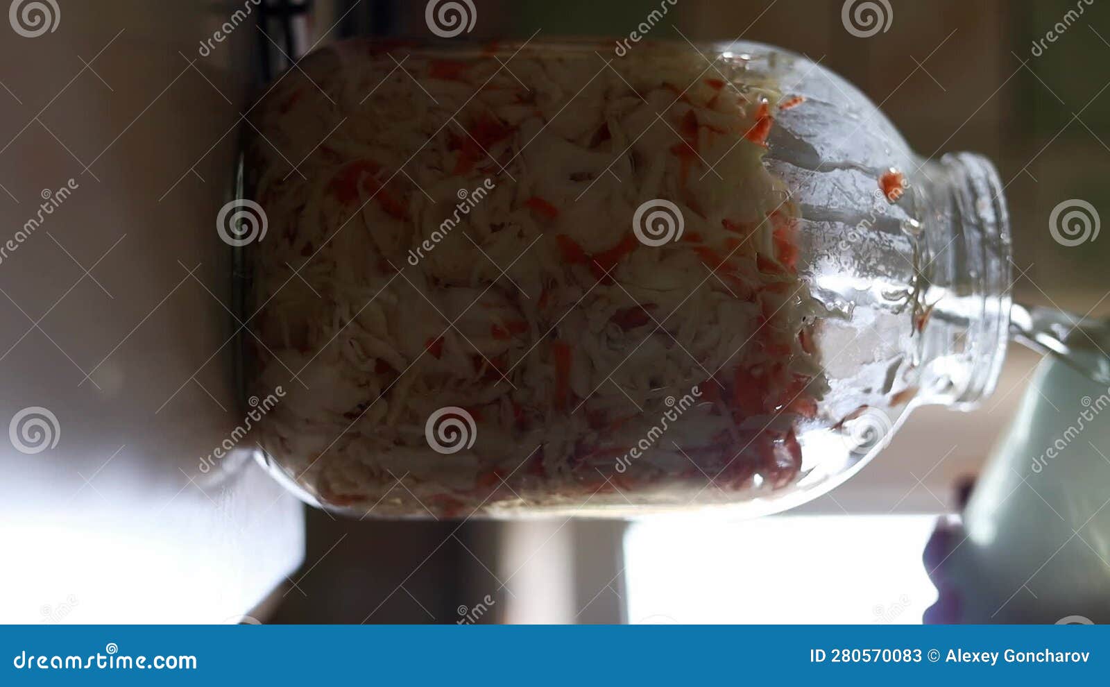 Water is Poured into a Jar of Cabbage. the Process of Fermenting ...