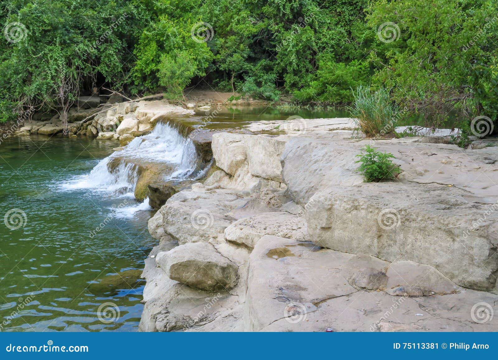 Water Pouring Over Sedimentary Rock To Create a Waterfall Stock Image ...