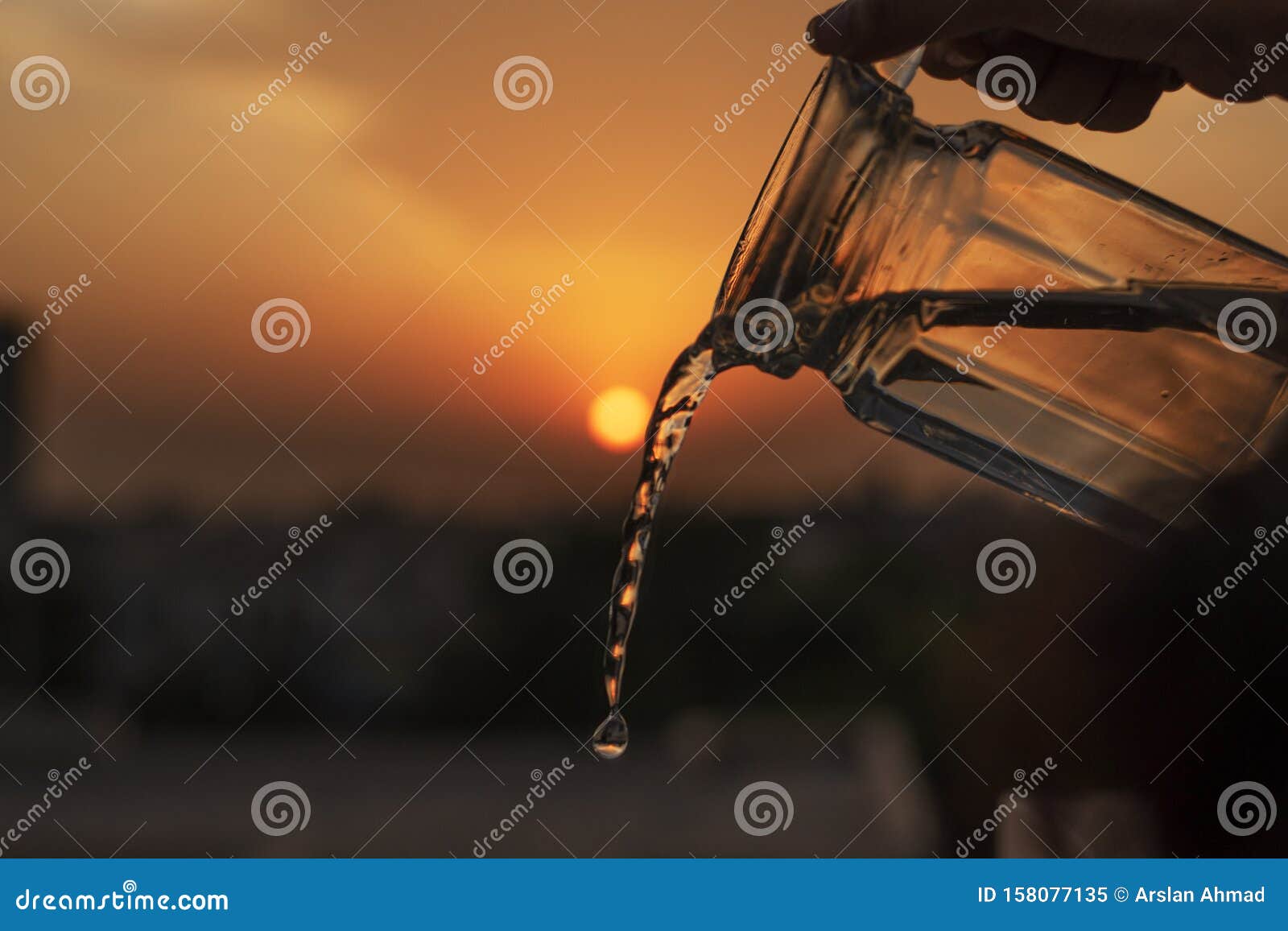 Water Pouring on the Sun during Golden Hour Stock Image - Image of ...