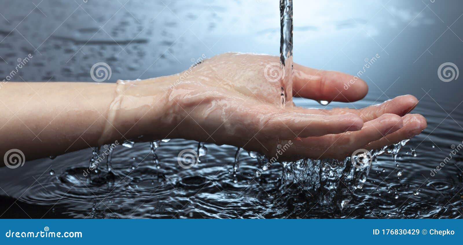 Water Pouring in Woman Hand on Blue Background Stock Image - Image of ...