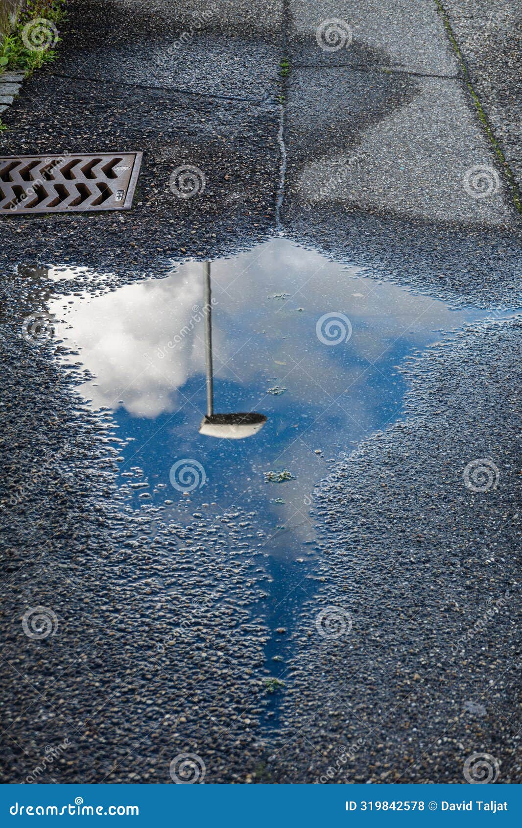 Water Puddle with Reflection of Streetlamp Stock Photo - Image of ...