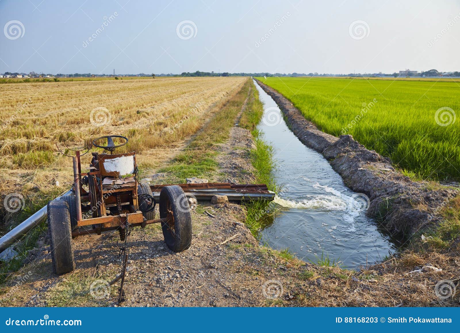 Water pump on rice field stock image. Image of background - 88168203