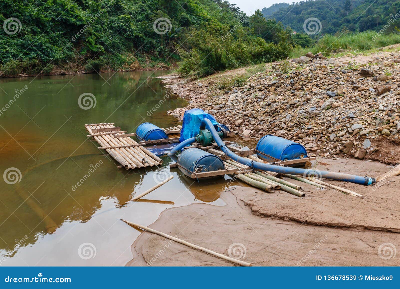 Water Pump on a Bamboo Raft Stock Image - Image of barrel, equipment ...