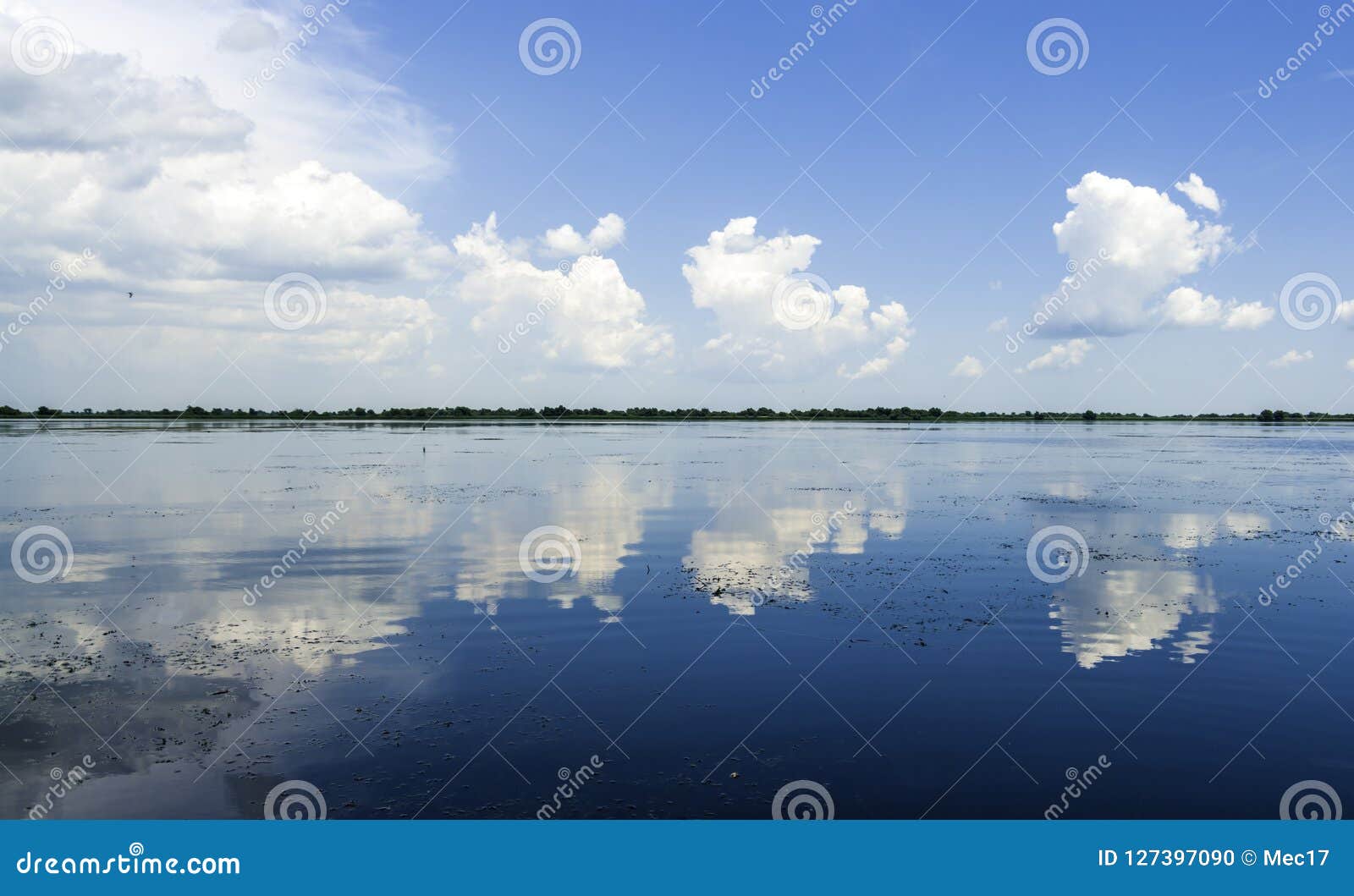 Water reflection of clouds stock photo. Image of clouds - 127397090