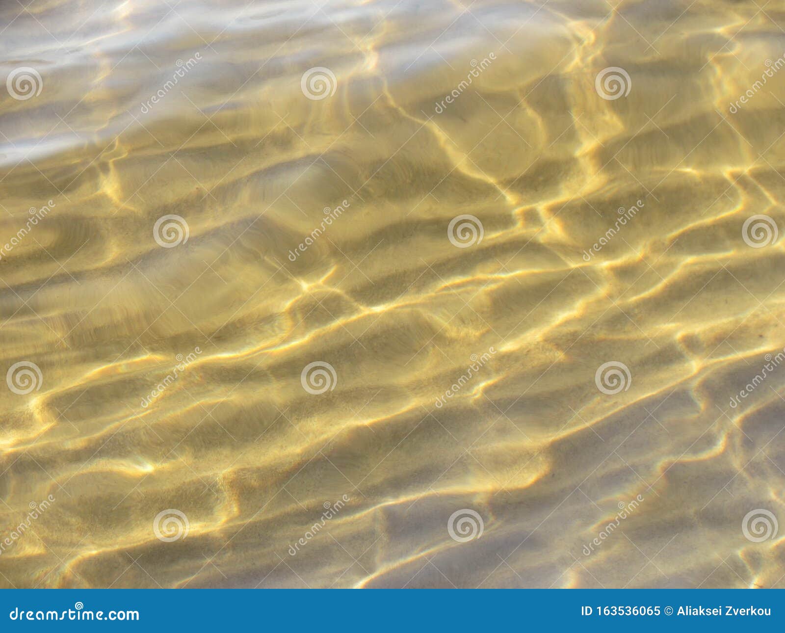 Water Ripples, with Yellow Sand at the Bottom of the Lake Stock Image ...
